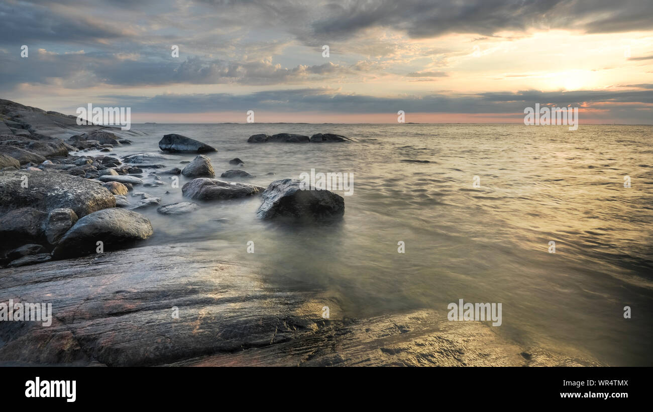 Sunset at sea in Finland Stock Photo - Alamy