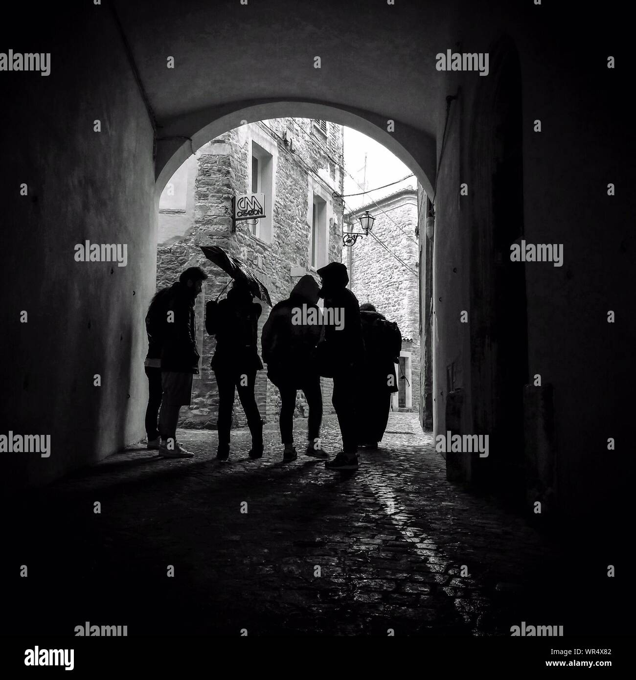 Walking under arch hi-res stock photography and images - Alamy