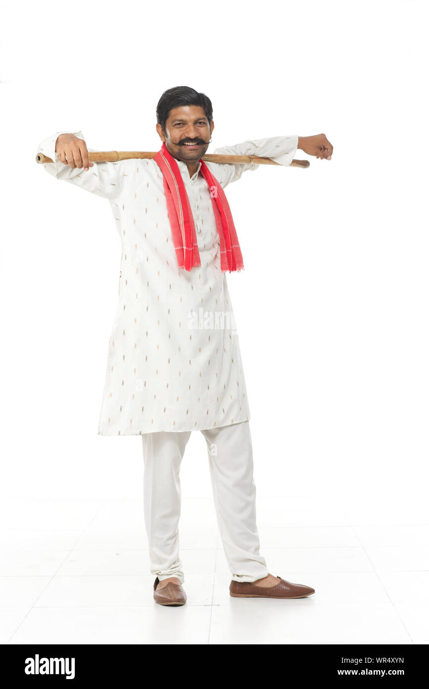 Rural man standing with his cane Stock Photo - Alamy