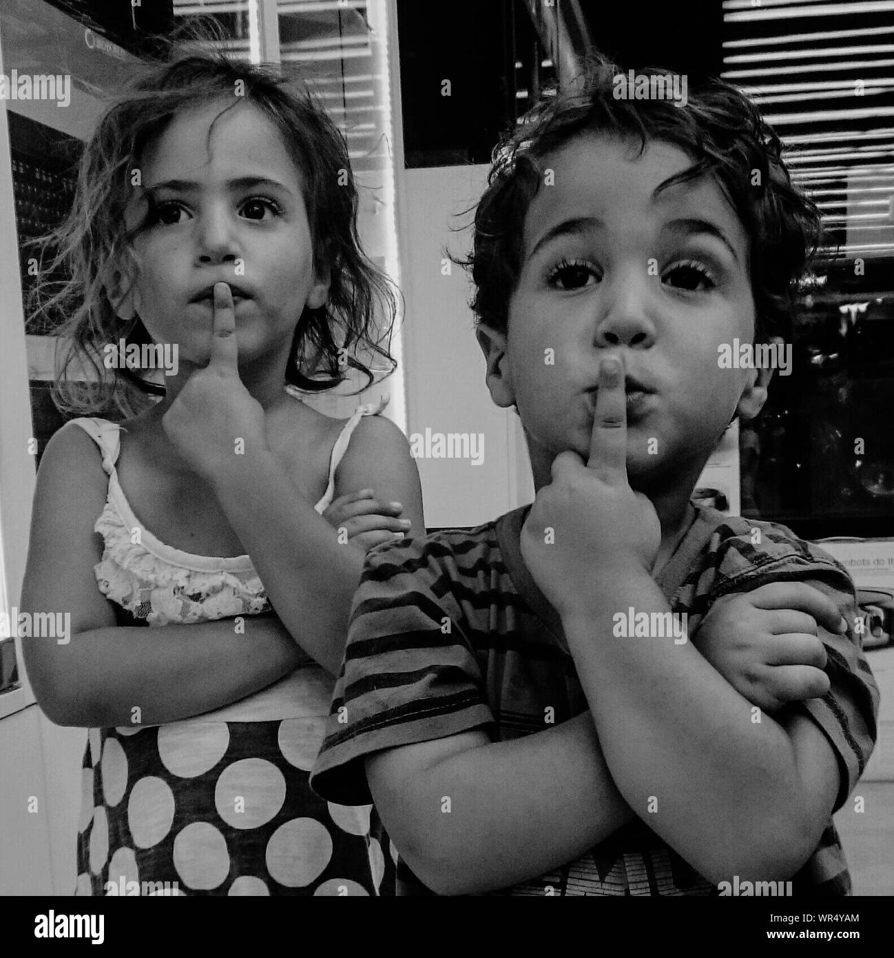 Finger on her lips hi-res stock photography and images - Alamy