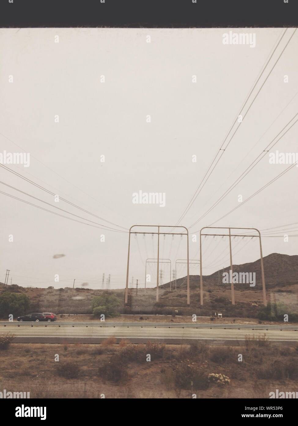 Power Line Crossing Over Highway Stock Photo - Alamy