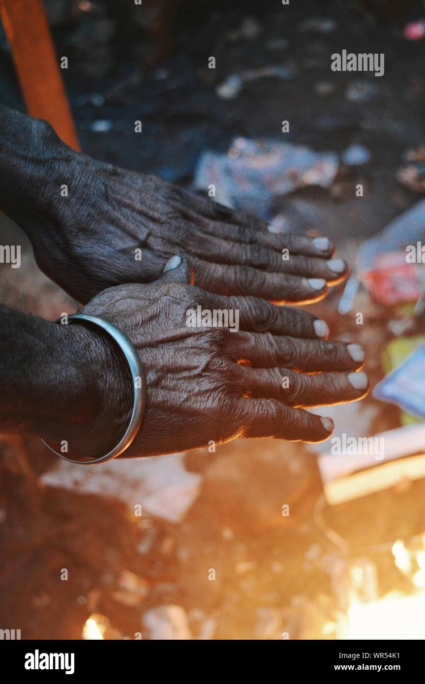 Warming hand over fire hi-res stock photography and images - Alamy