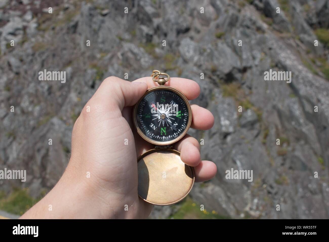 Compass hand hi-res stock photography and images - Alamy
