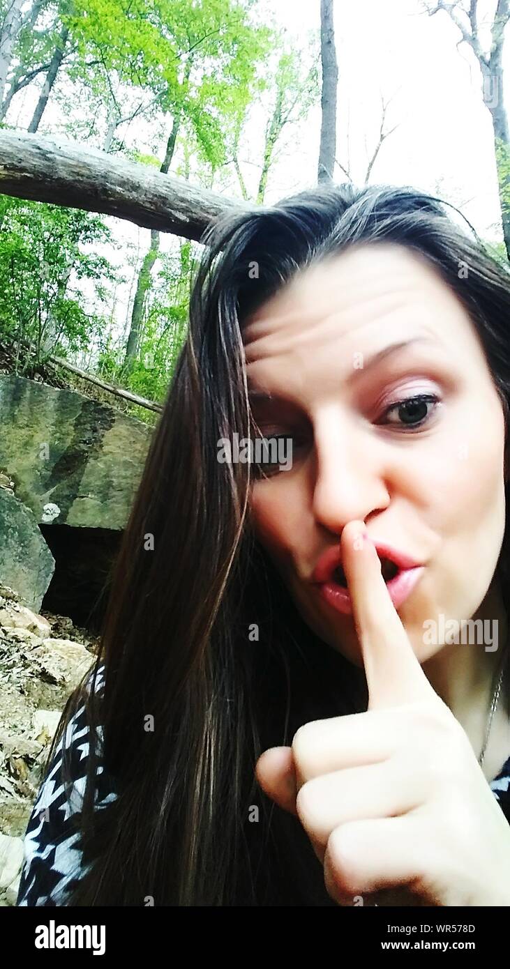 Finger on the lip hi-res stock photography and images - Alamy