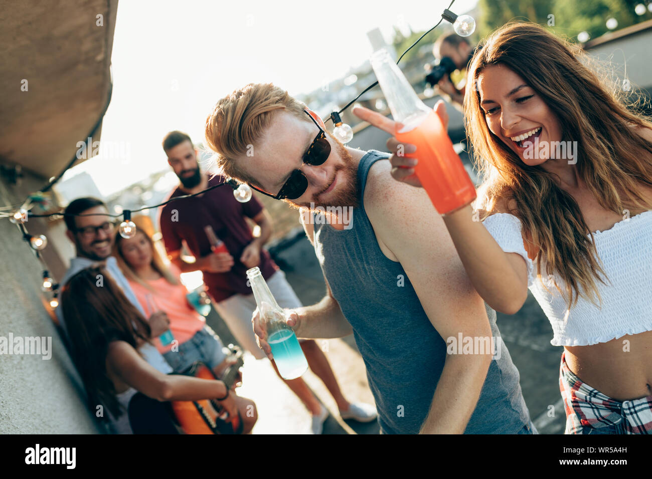 Happy group of young friends having fun in summer Stock Photo - Alamy