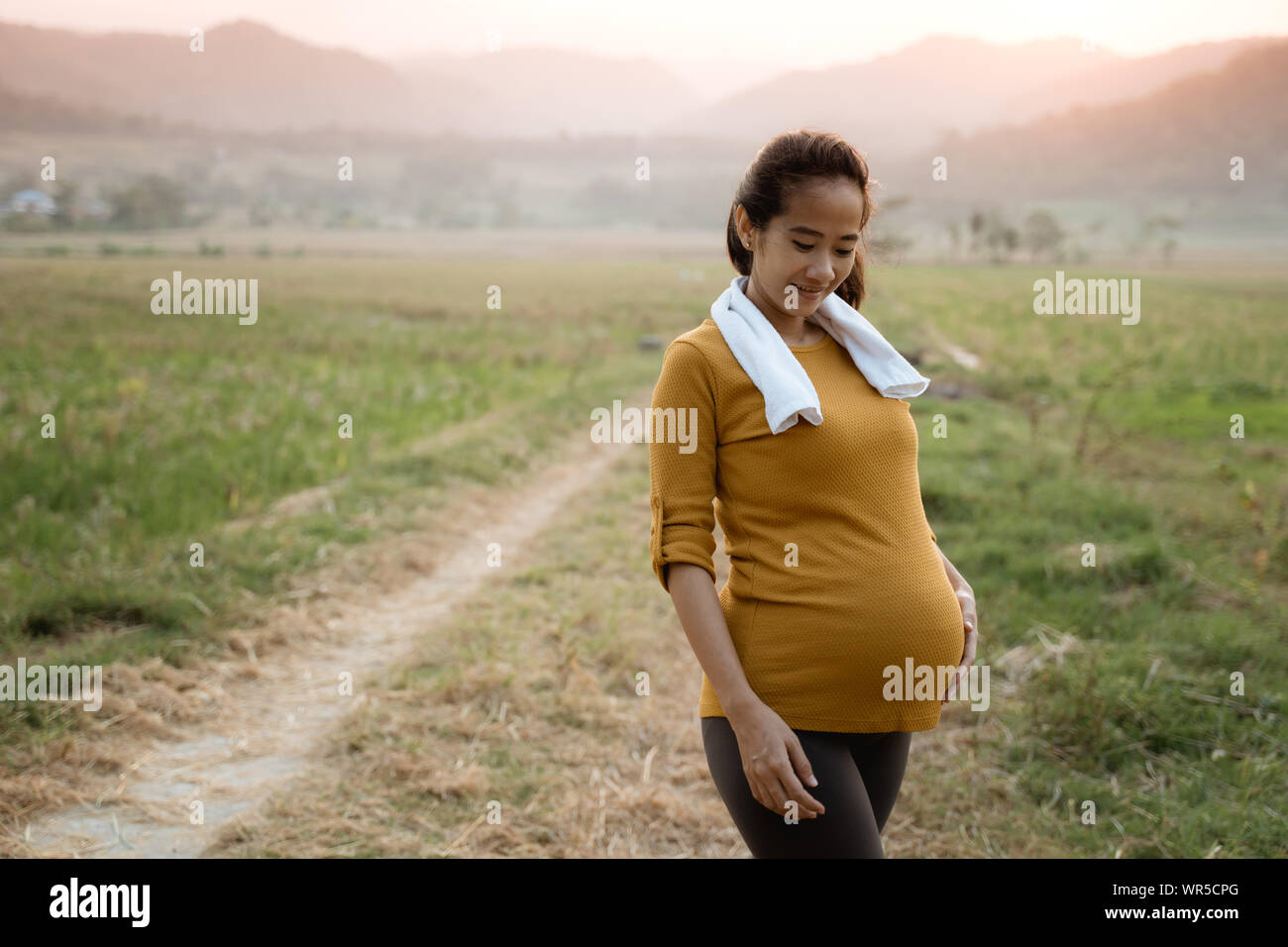 maternity woman take a break after workout outdoor Stock Photo - Alamy