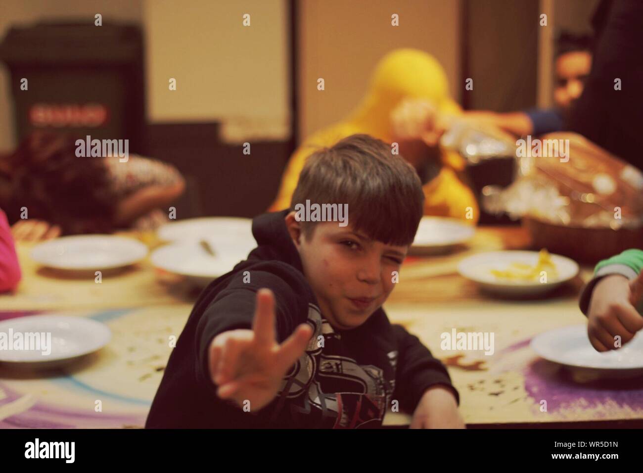 Boy at sign hi-res stock photography and images - Alamy