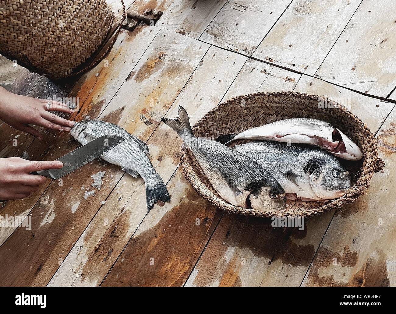 Cleaning fish hi-res stock photography and images - Alamy