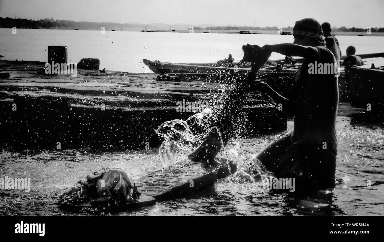 Man washing clothes hi-res stock photography and images - Alamy