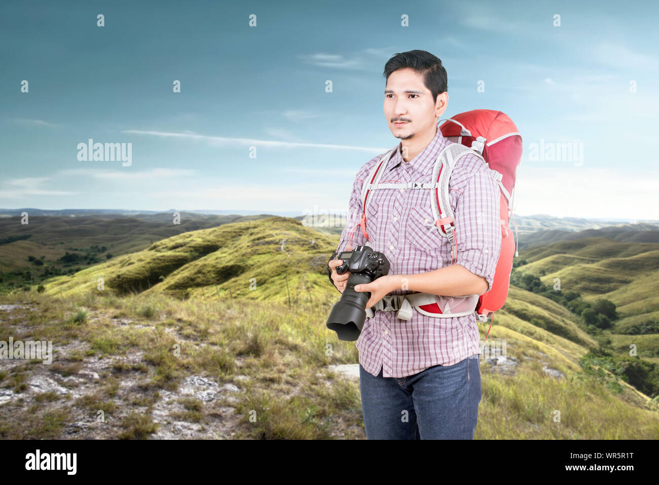 Asian traveler holding camera backpack hi-res stock photography and ...