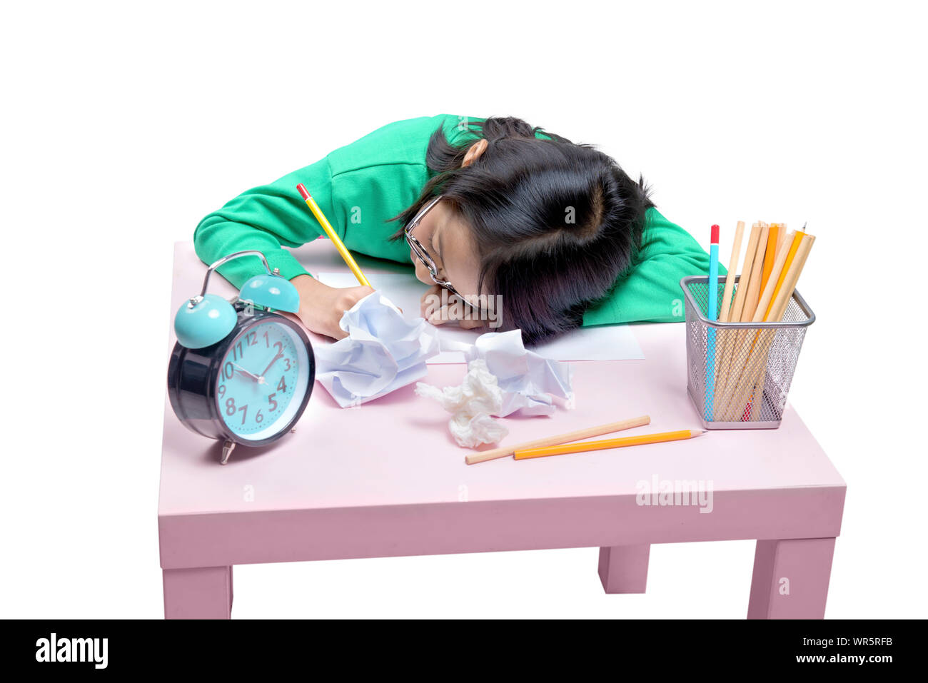 Asian cute girl in glasses fall asleep while writing on the desk ...