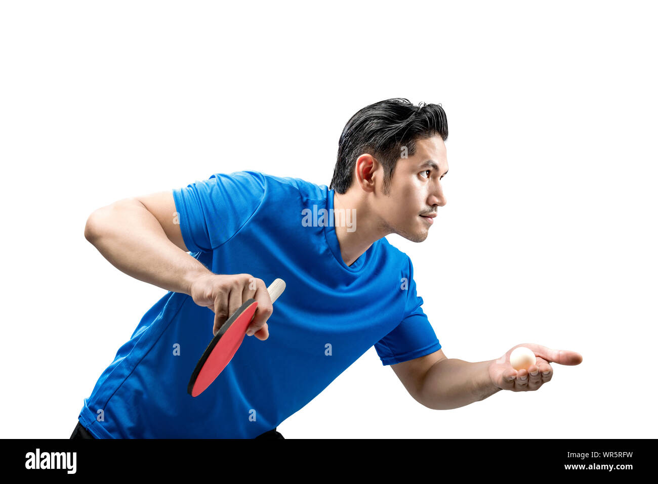 Asian table tennis player man in serving position isolated over white ...
