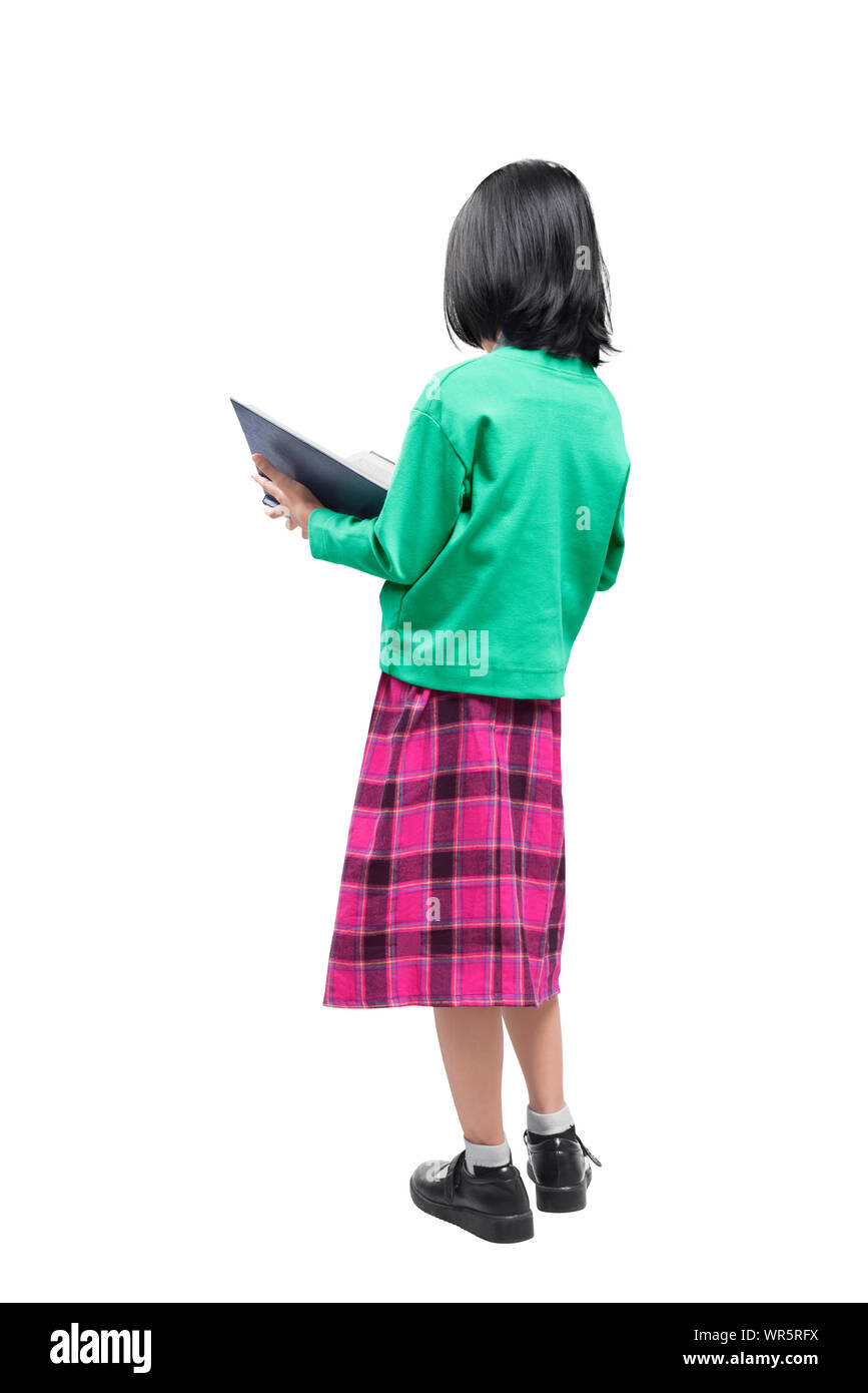 Rear view of Asian cute girl standing while reading the book isolated ...