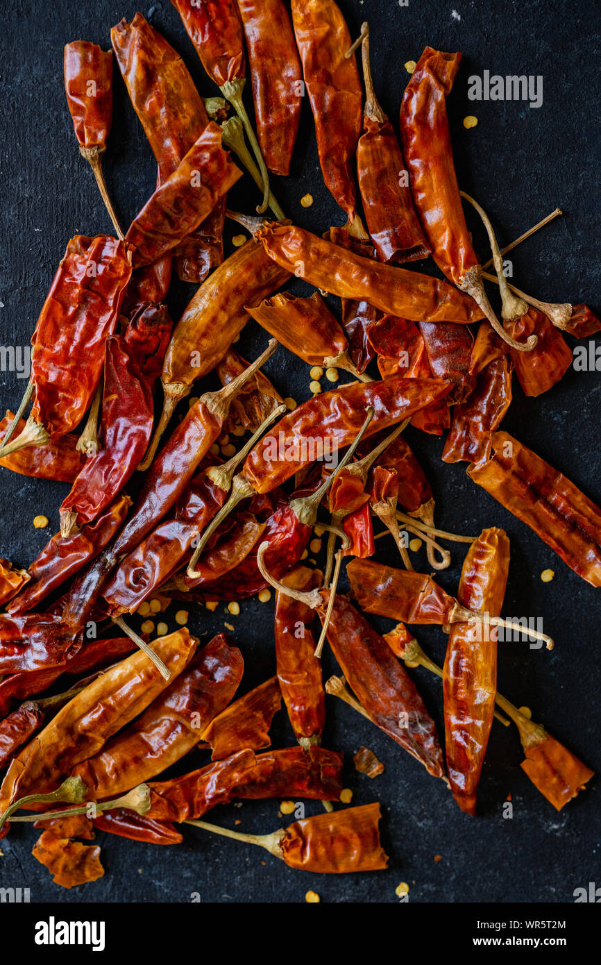Whole dried chilli peppers with seeds Stock Photo - Alamy