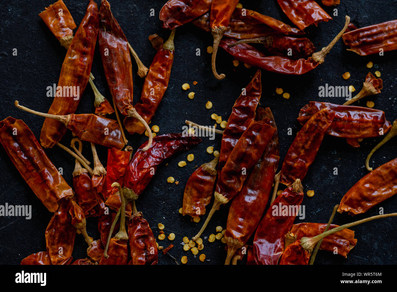 Whole dried chilli peppers with seeds Stock Photo - Alamy