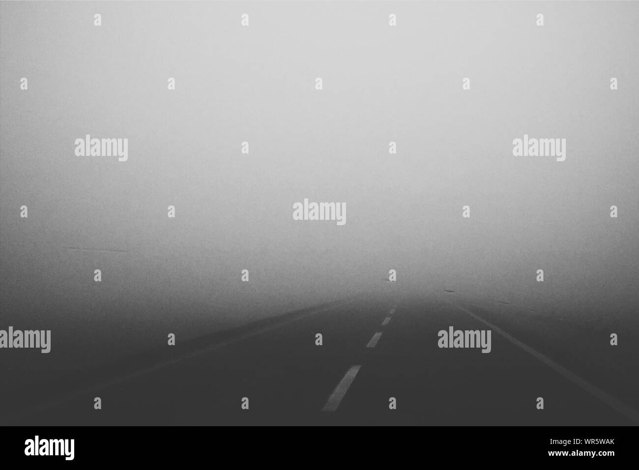 View Of Road With During Fog Stock Photo - Alamy