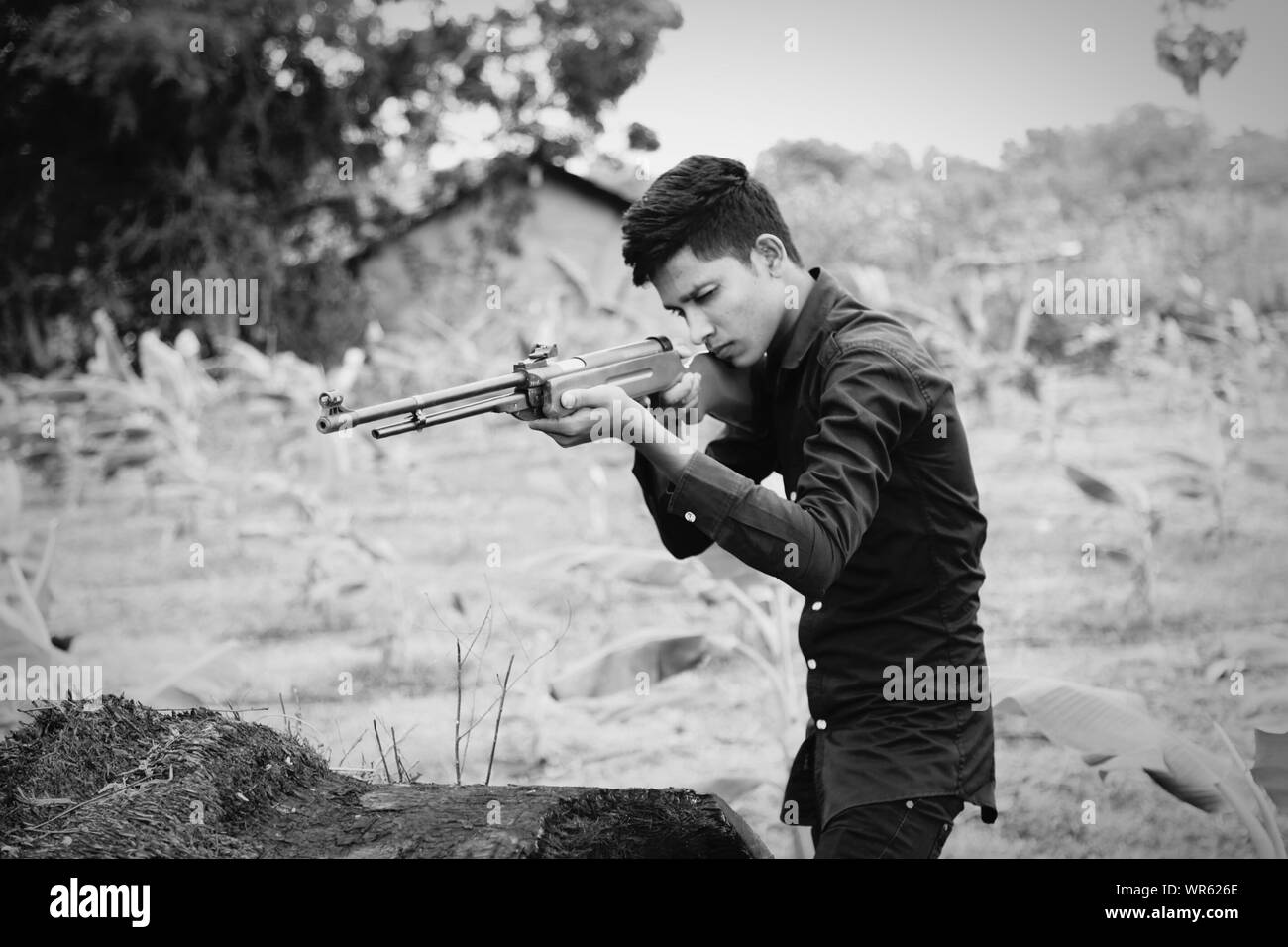 Young man aiming gun hi-res stock photography and images - Alamy