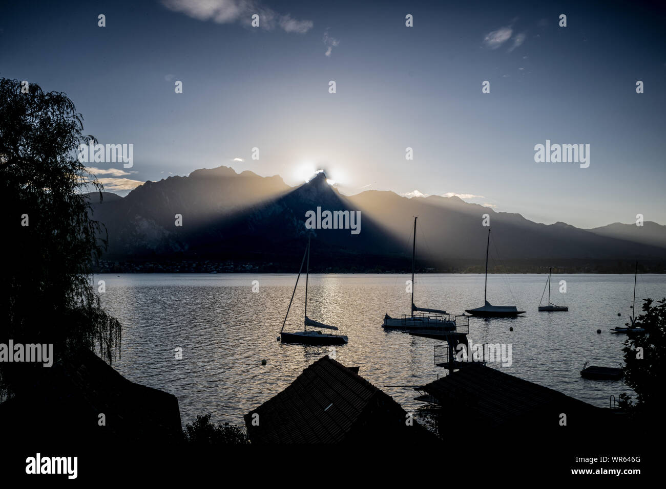 Sunset behind Stockhorn mountain peak throwing a big shadow over the ...