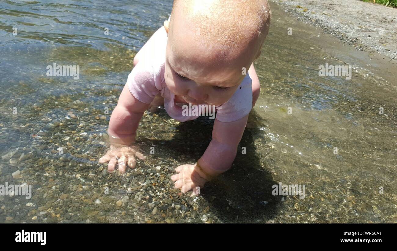 Cute baby in water hi-res stock photography and images - Alamy