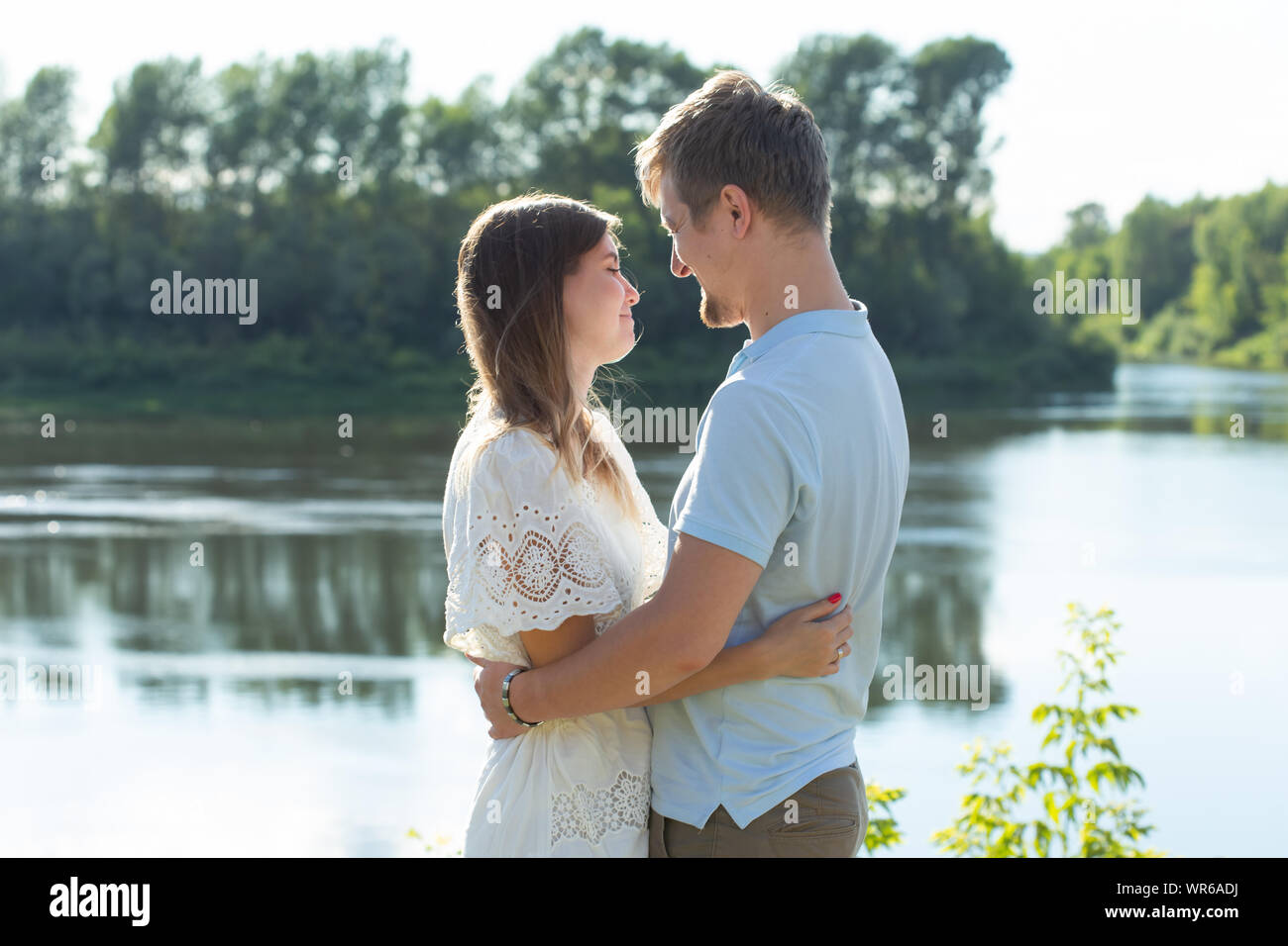 happy romantic couple in love and having fun outdoor in summer day ...