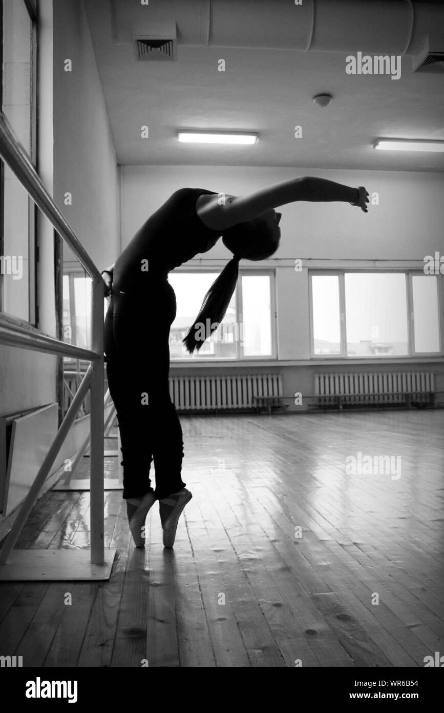 Woman bending Black and White Stock Photos & Images - Alamy