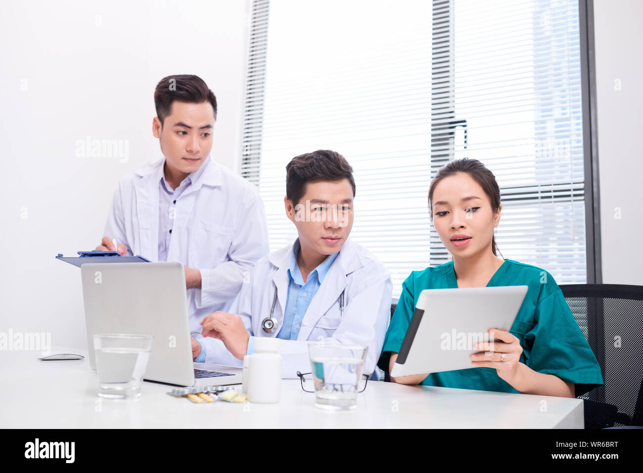 picture of young team or group of doctors working Stock Photo - Alamy