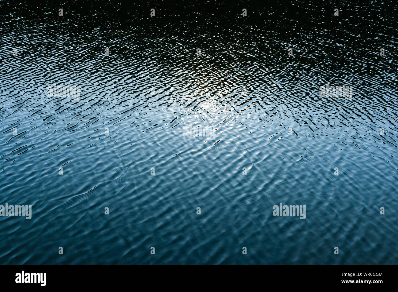 Lake water waves texture blue tones as background Stock Photo - Alamy