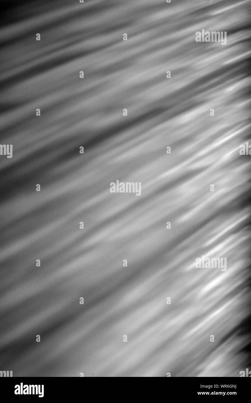 Black and white image of light reflected on a wall Stock Photo - Alamy