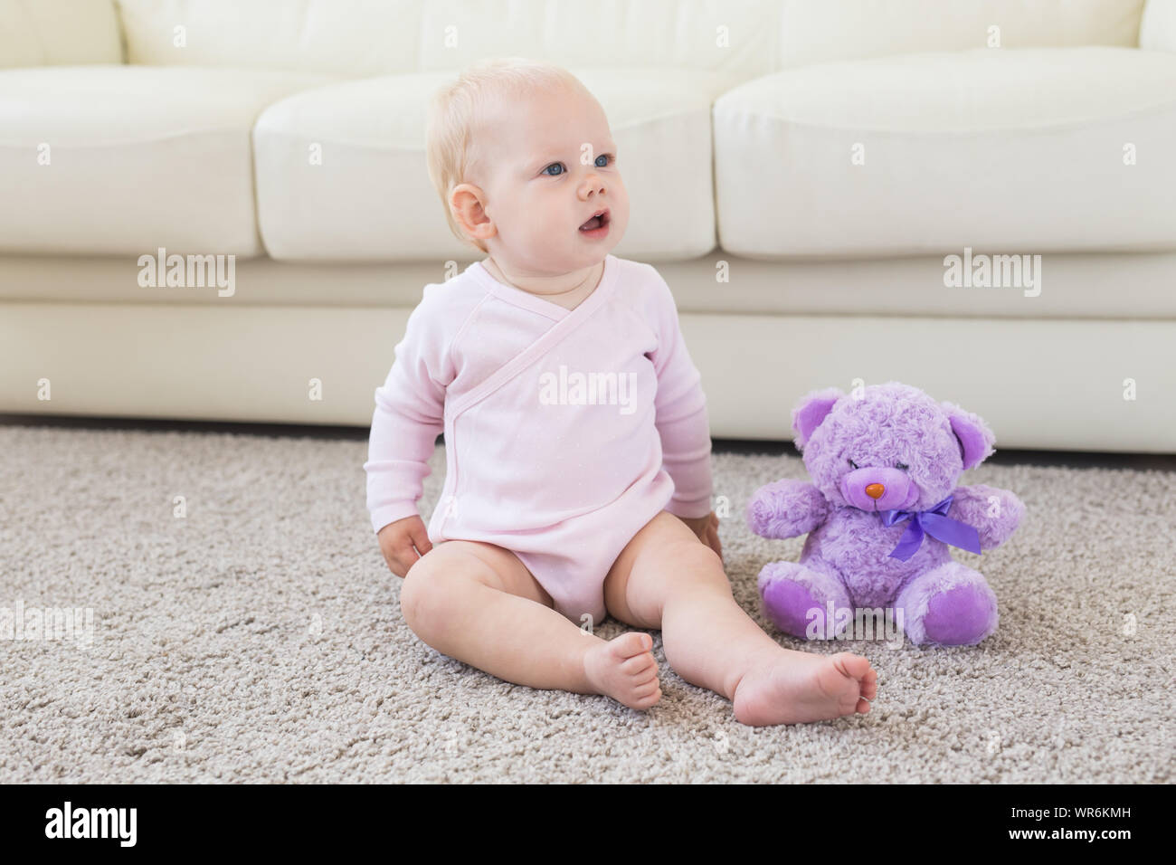 childhood, babyhood and children concept - happy little baby girl ...