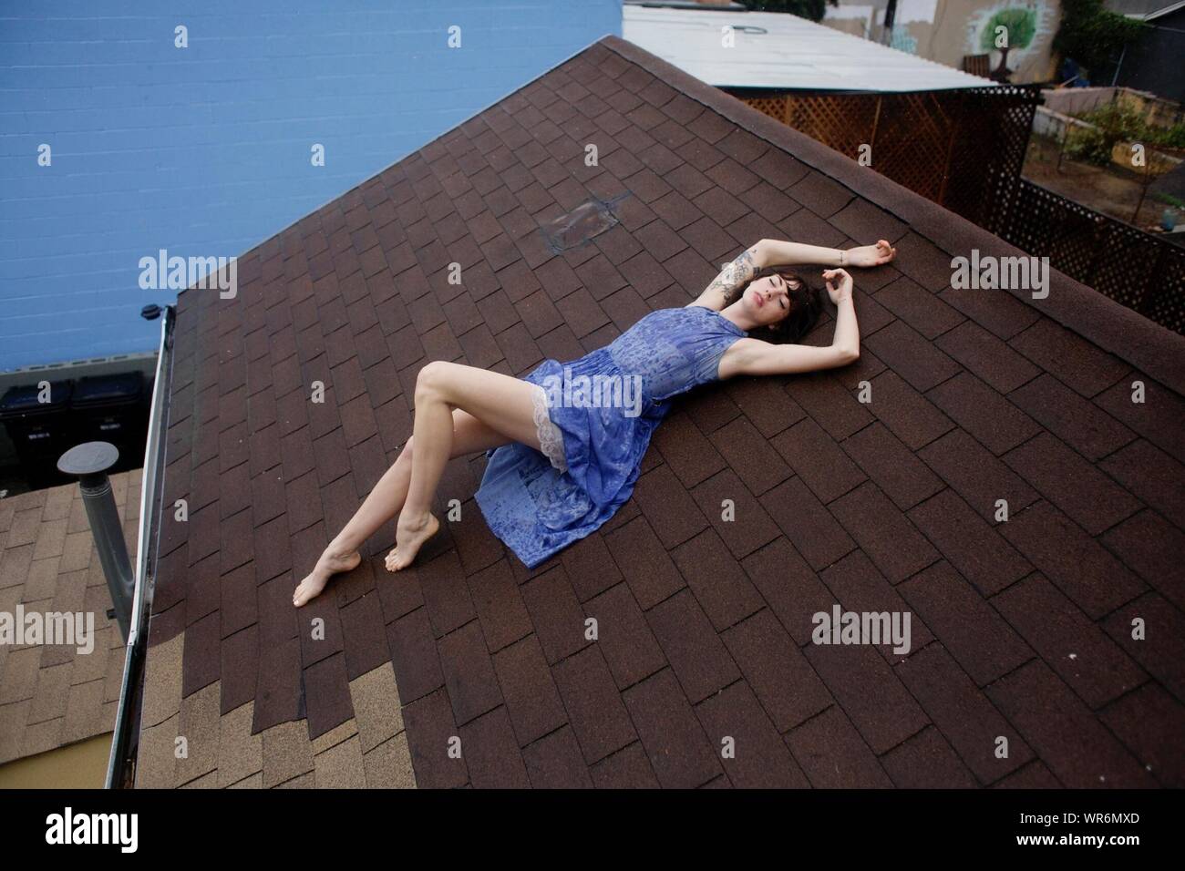 Young Woman Lying On Roof High Resolution Stock Photography and Images ...