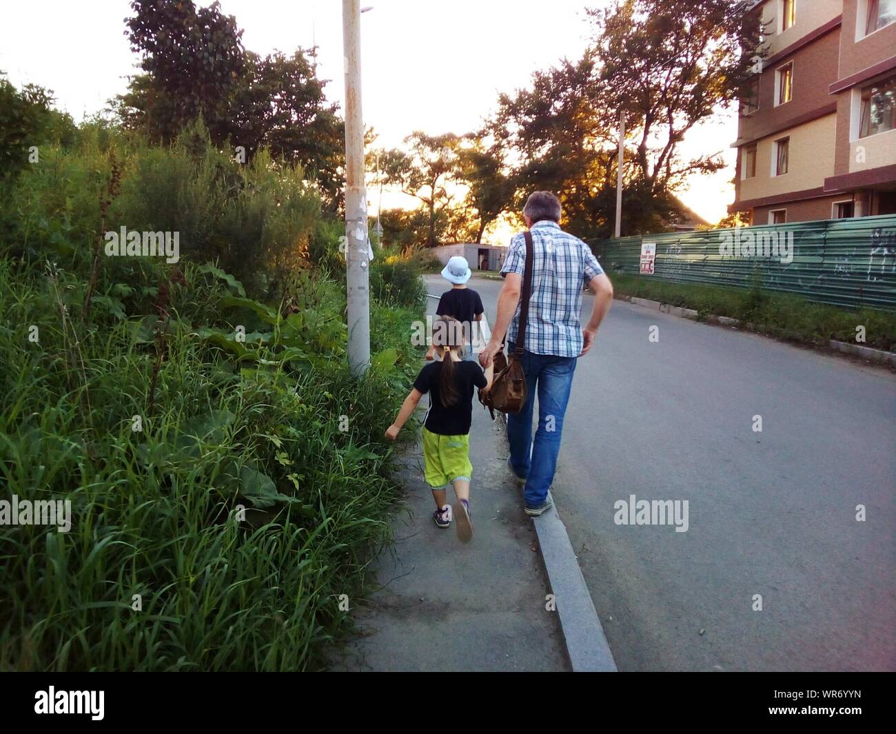 Children walking sidewalk hi-res stock photography and images - Alamy