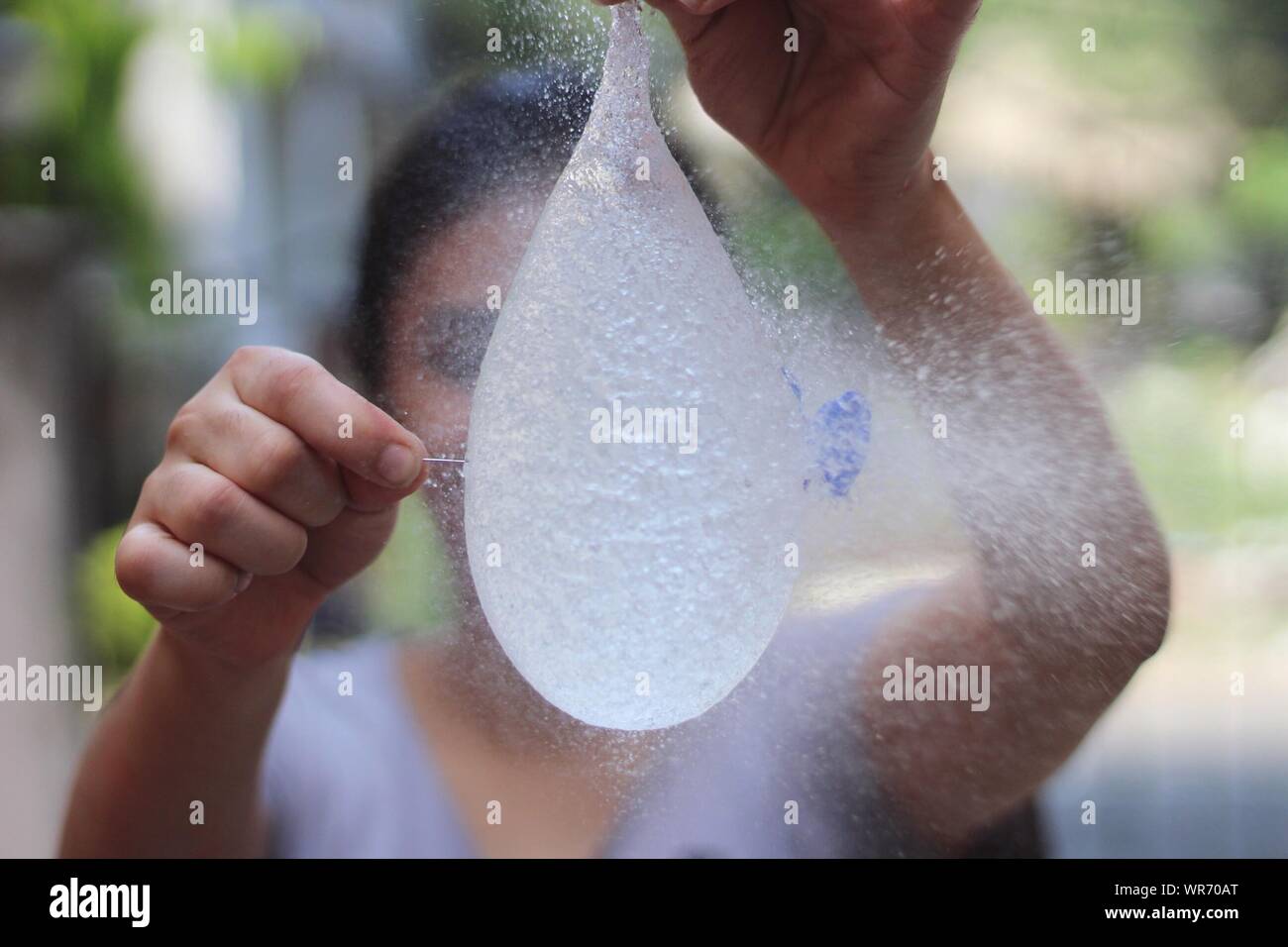 Breaking water balloon hi-res stock photography and images - Alamy