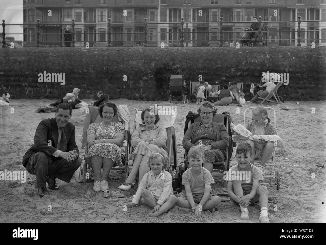 Group on beach Stock Photo - Alamy