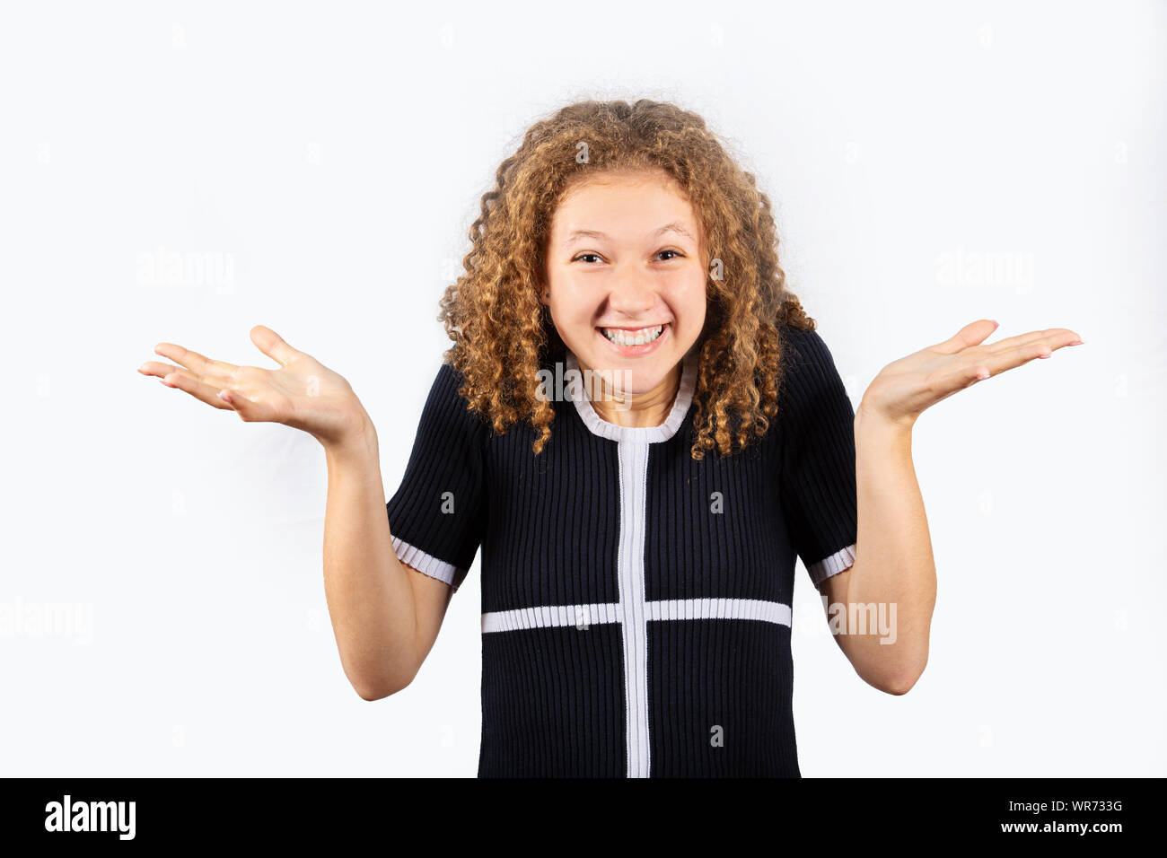 Happy young girl holding hand up and laugh. Expressive facial ...
