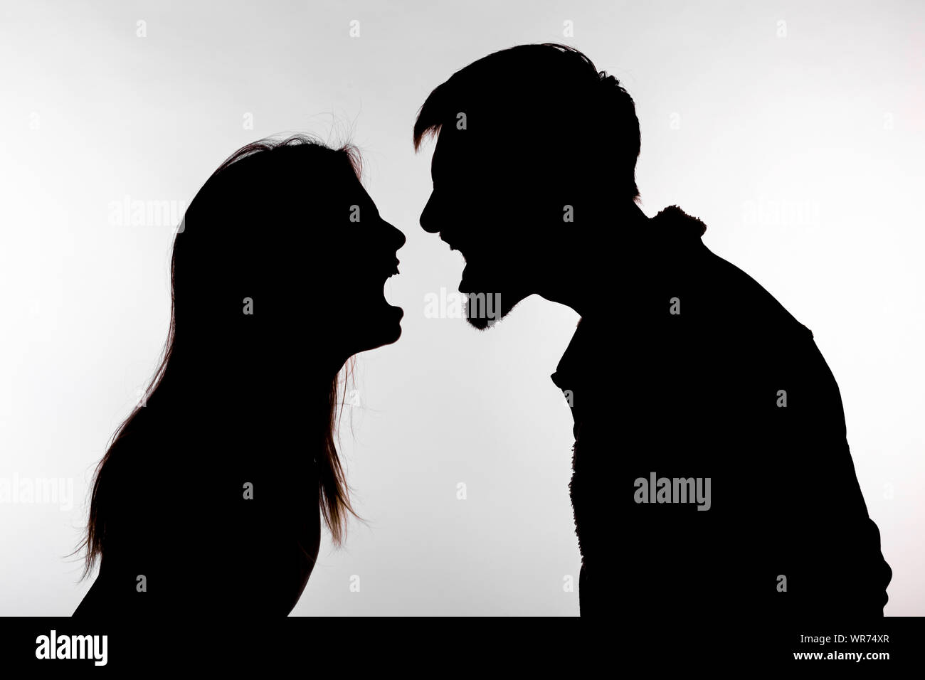 Aggression and abuse concept - man and woman expressing domestic ...