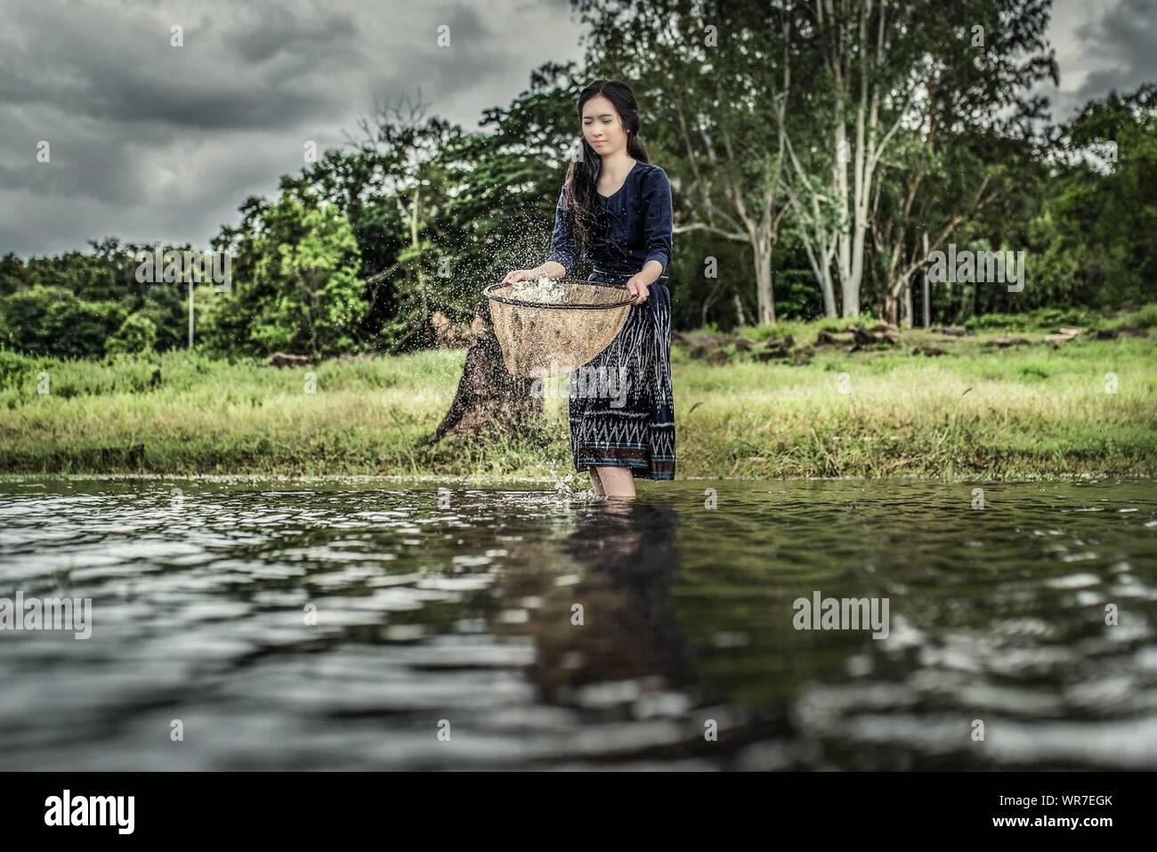 Asian woman fishing hi-res stock photography and images - Alamy