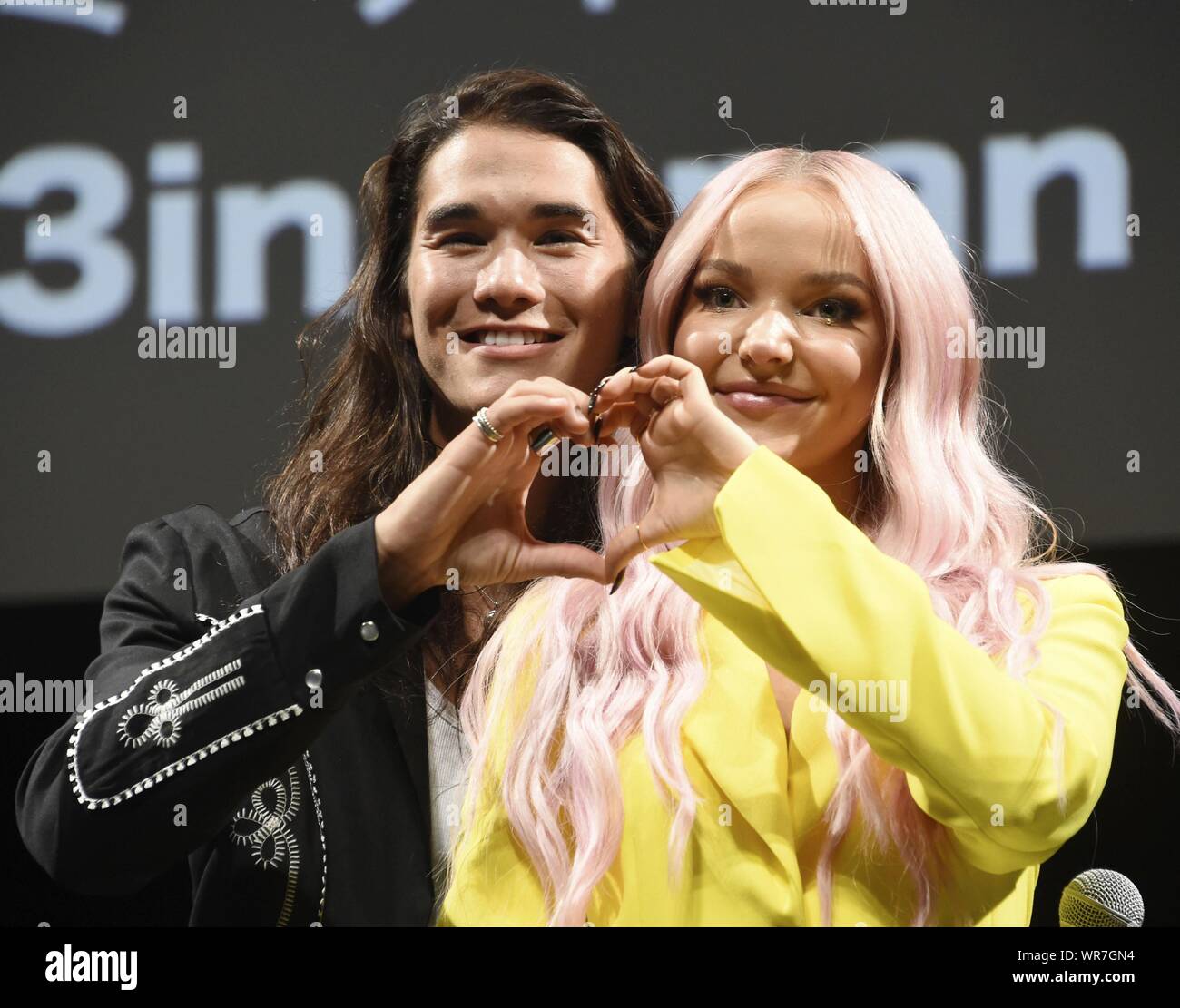 Dove Cameron (R) and Booboo Stewart pose for a photo in Tokyo to ...