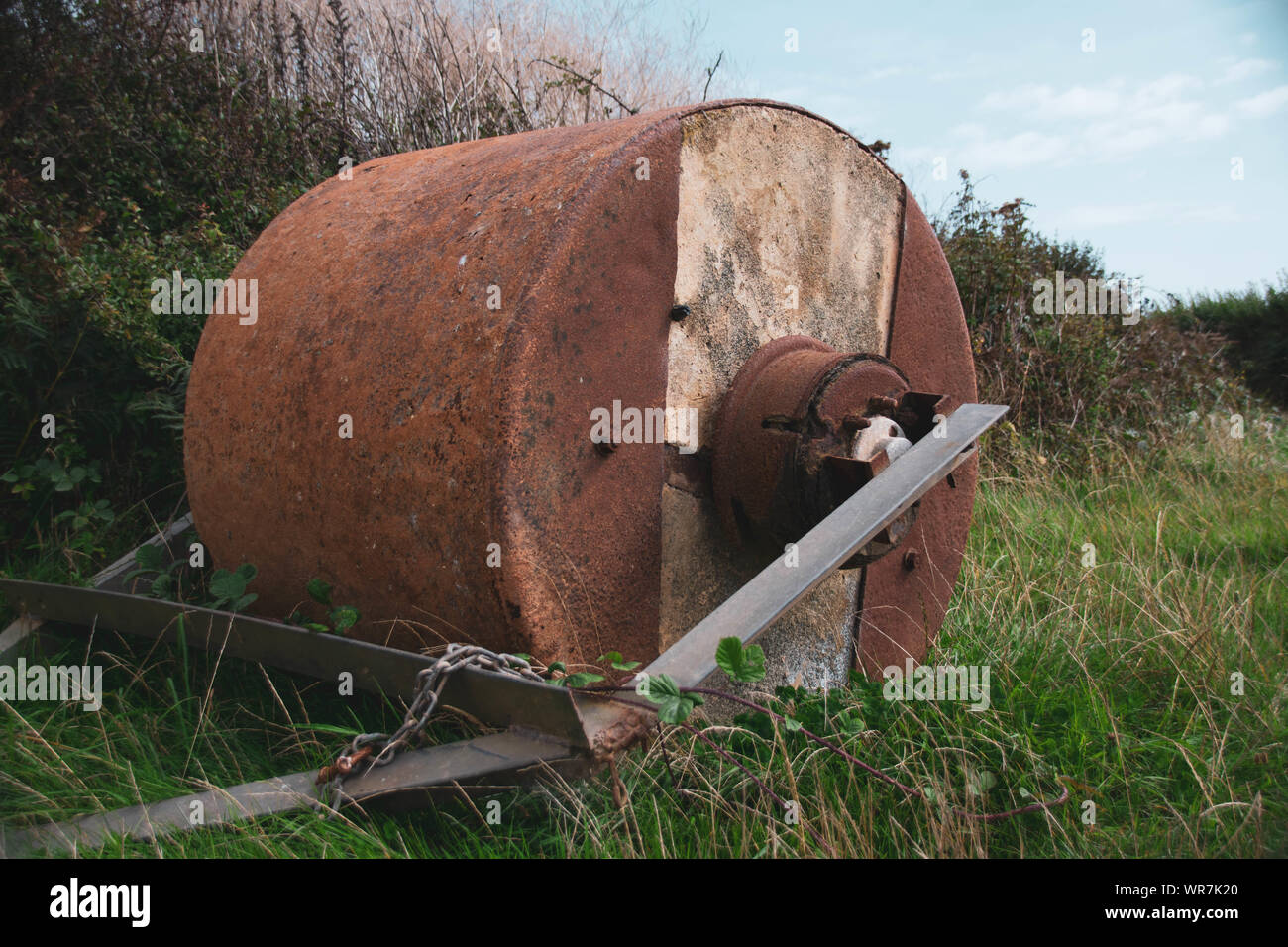 An old rusty machine left abandoned in a field Stock Photo - Alamy