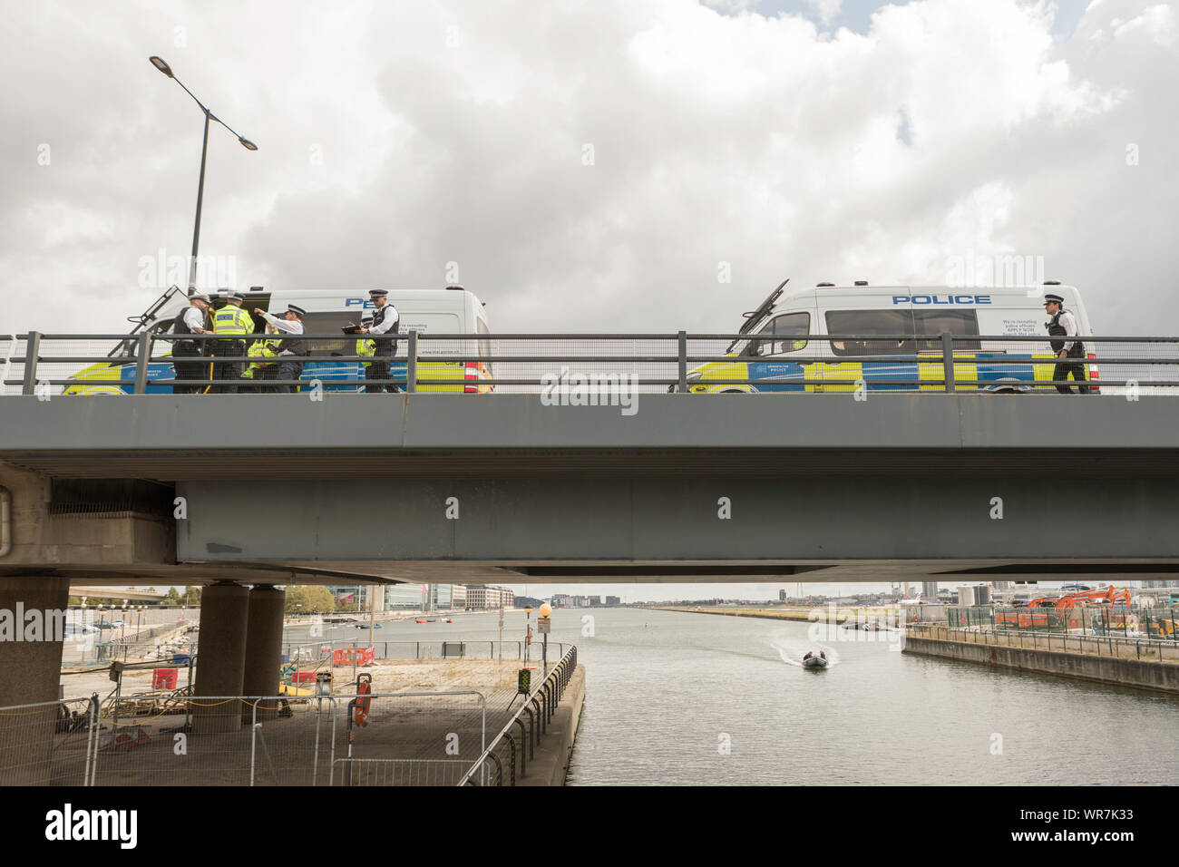 Two police vans on the Connaught Bridge. London, UK Stock Photo - Alamy