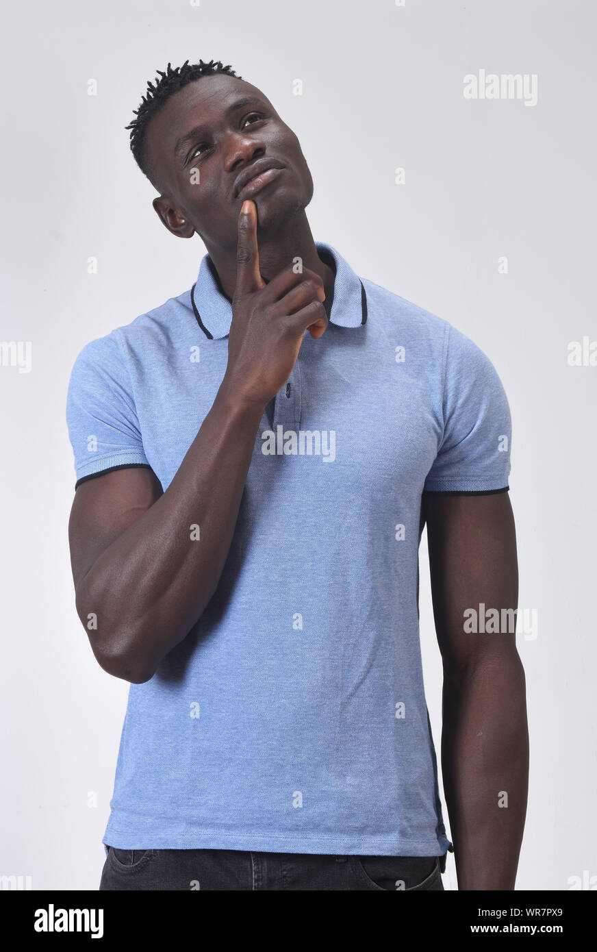 african man having a doubt or question on white background Stock Photo ...