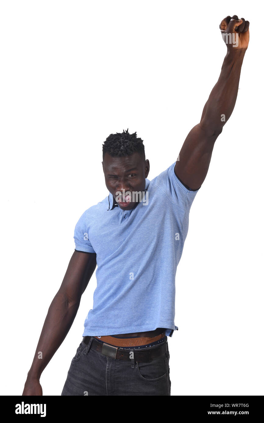 african man raising her arms and smiling in victory sign on white ...