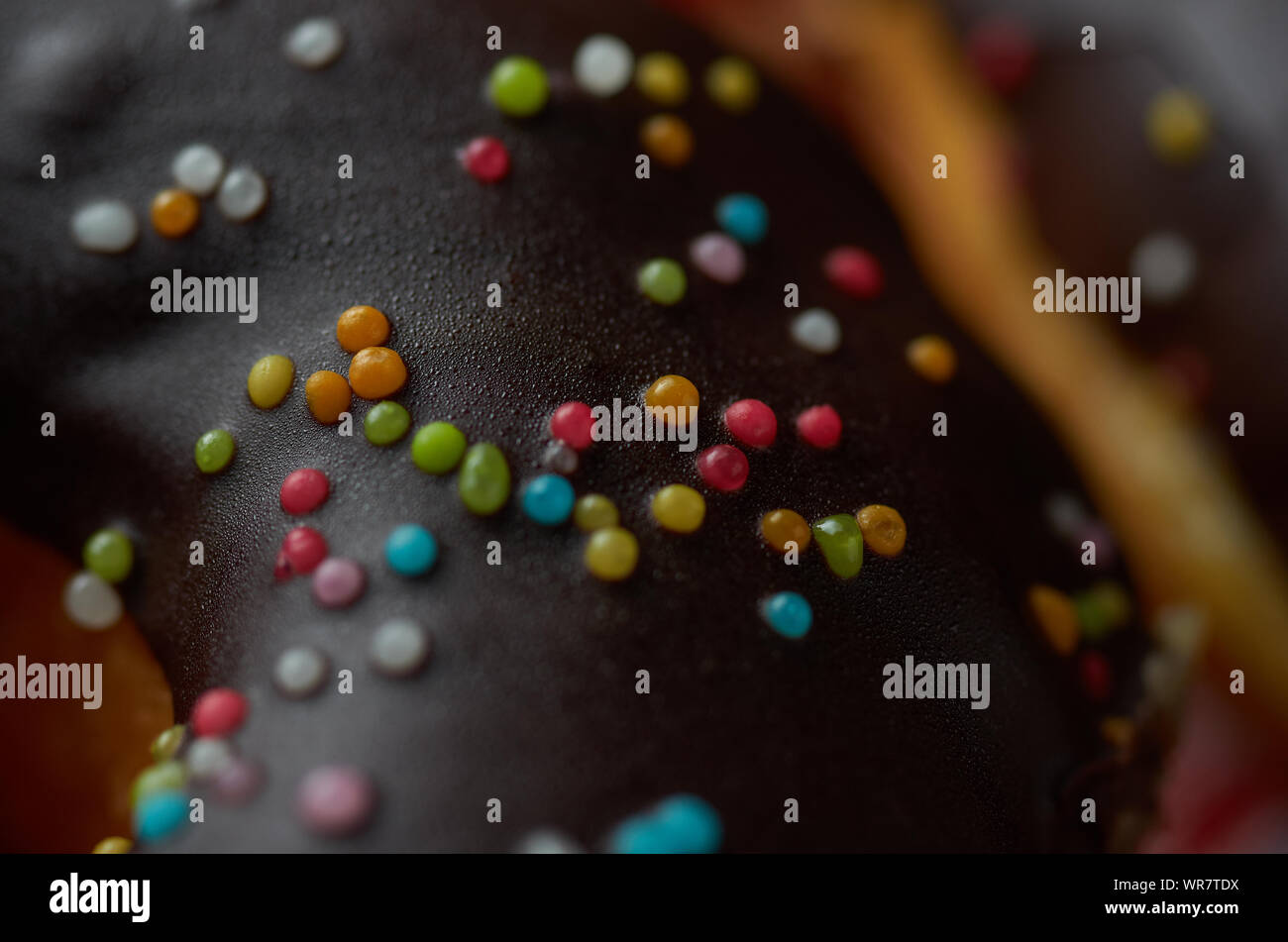 Colorful topping on chocolate surface of the dessert Stock Photo - Alamy