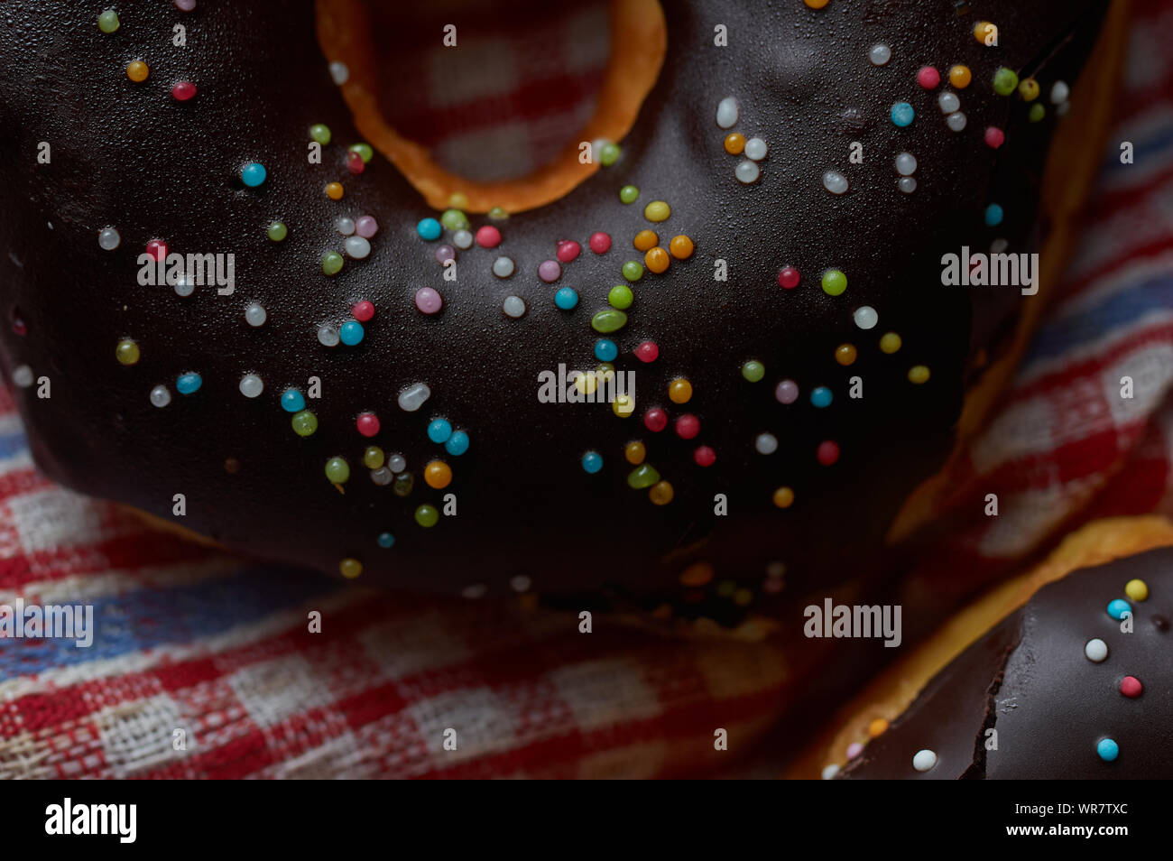 Colorful topping on chocolate surface of the dessert Stock Photo - Alamy