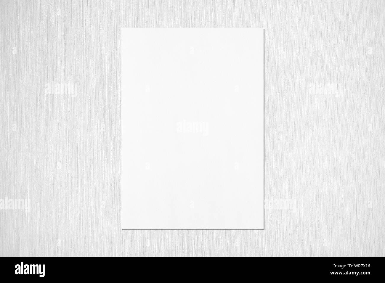Empty white vertical rectangle poster mockup with soft shadow on ...