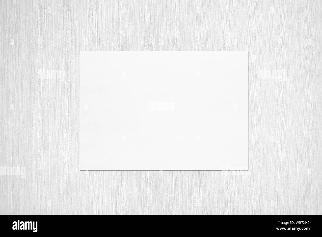 Empty white horizontal rectangle poster mockup with soft shadow on ...