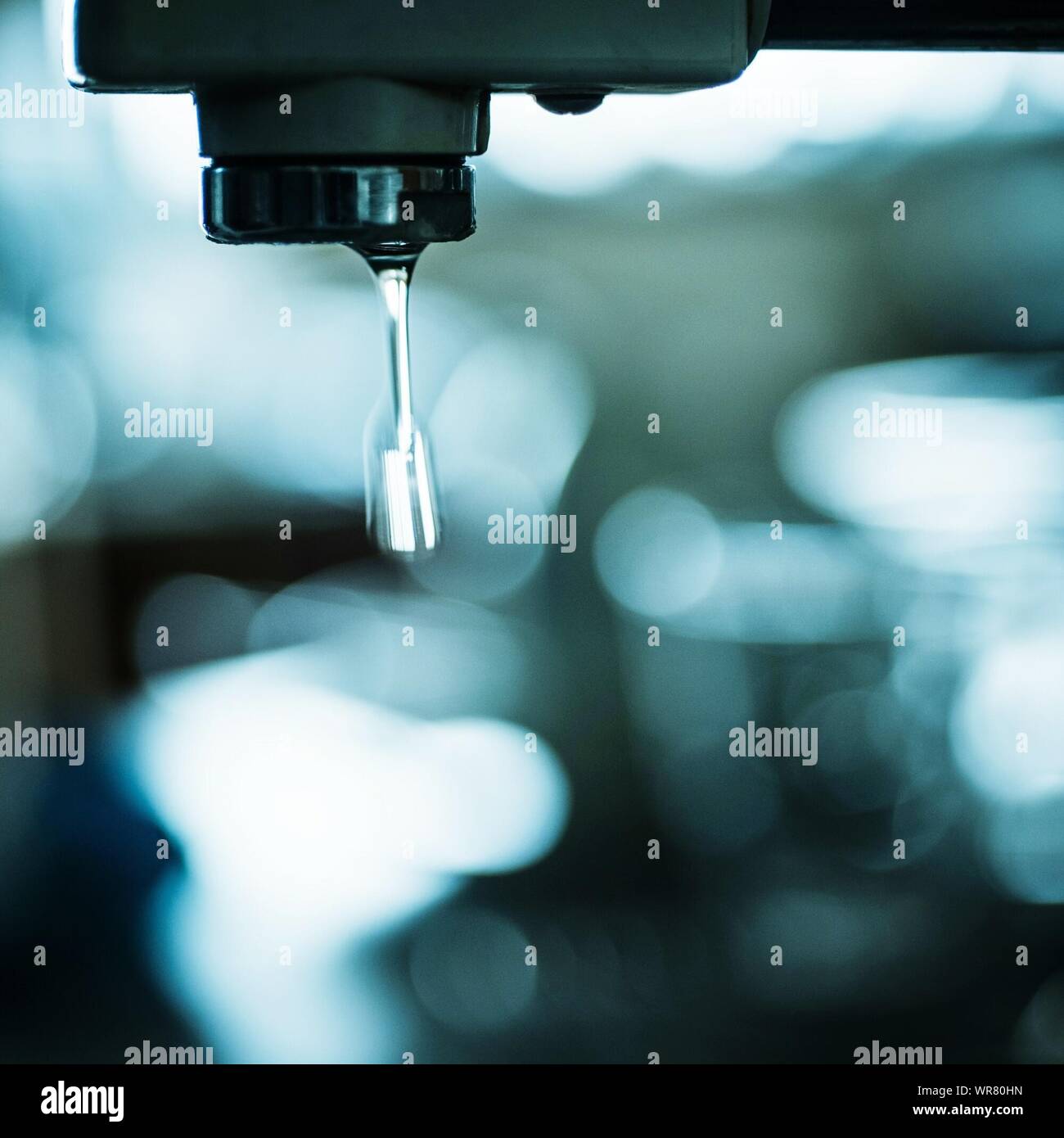 Blurred Motion Of Drinking Water Falling From Faucet Stock Photo - Alamy