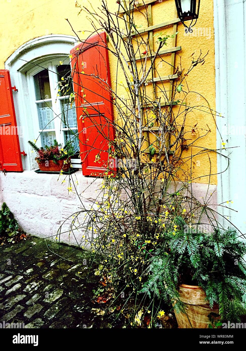 Red and yellow window shutter hi-res stock photography and images - Alamy