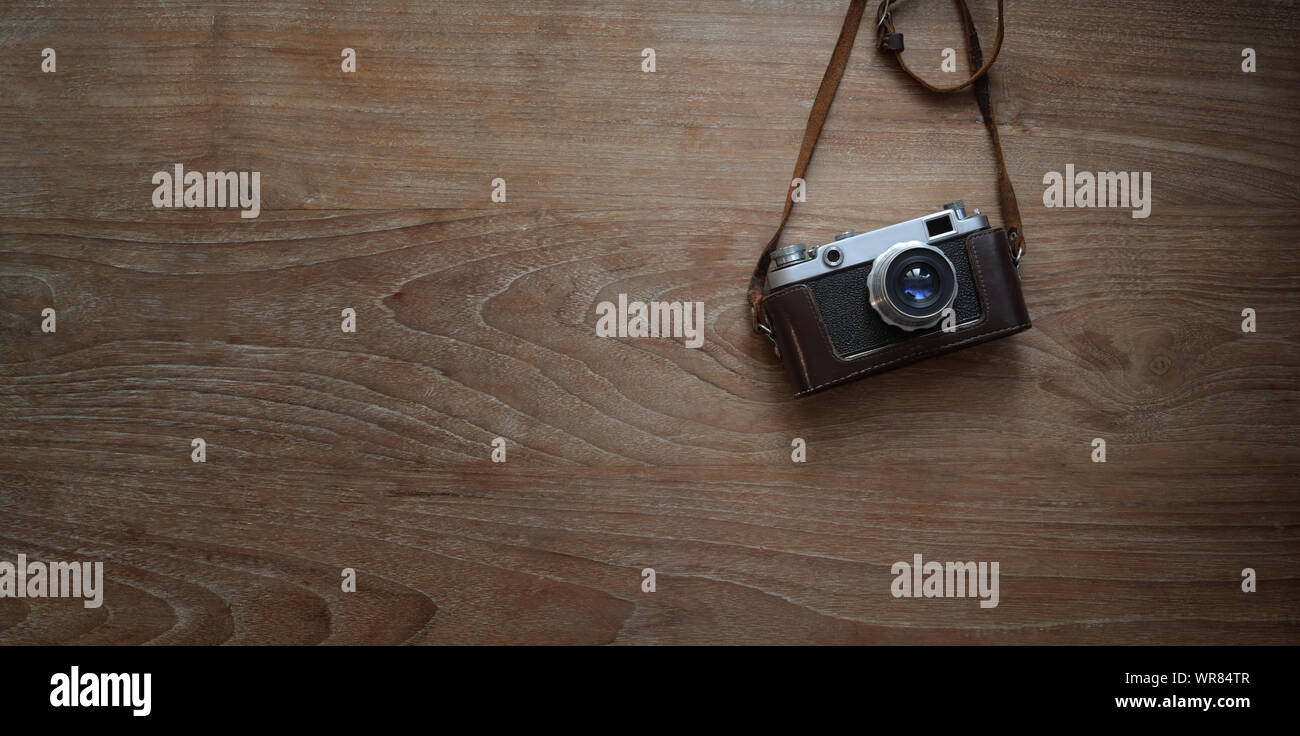 Top view of vintage camera on rustic wood table background Stock Photo ...