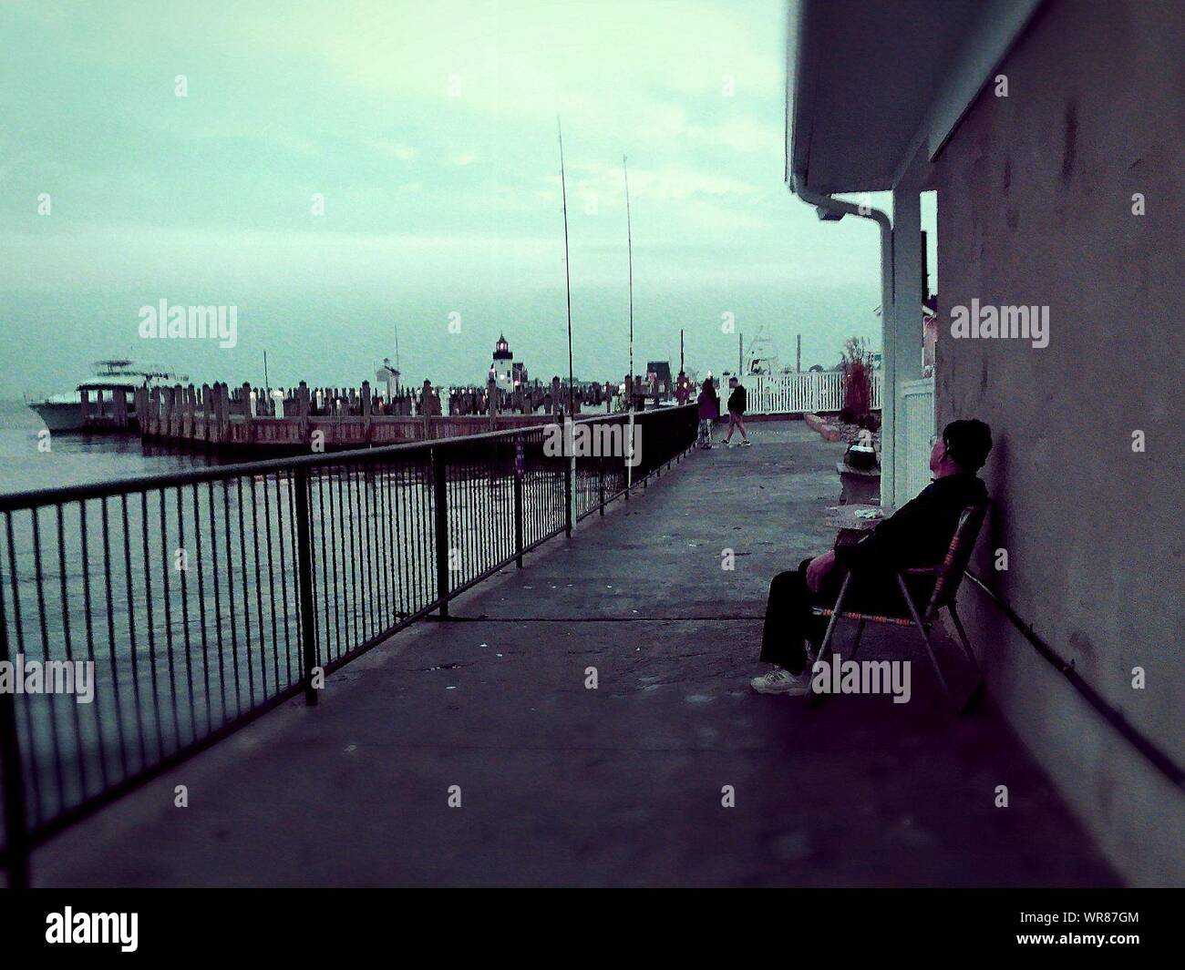 Man Sitting On Dock High Resolution Stock Photography and Images - Alamy