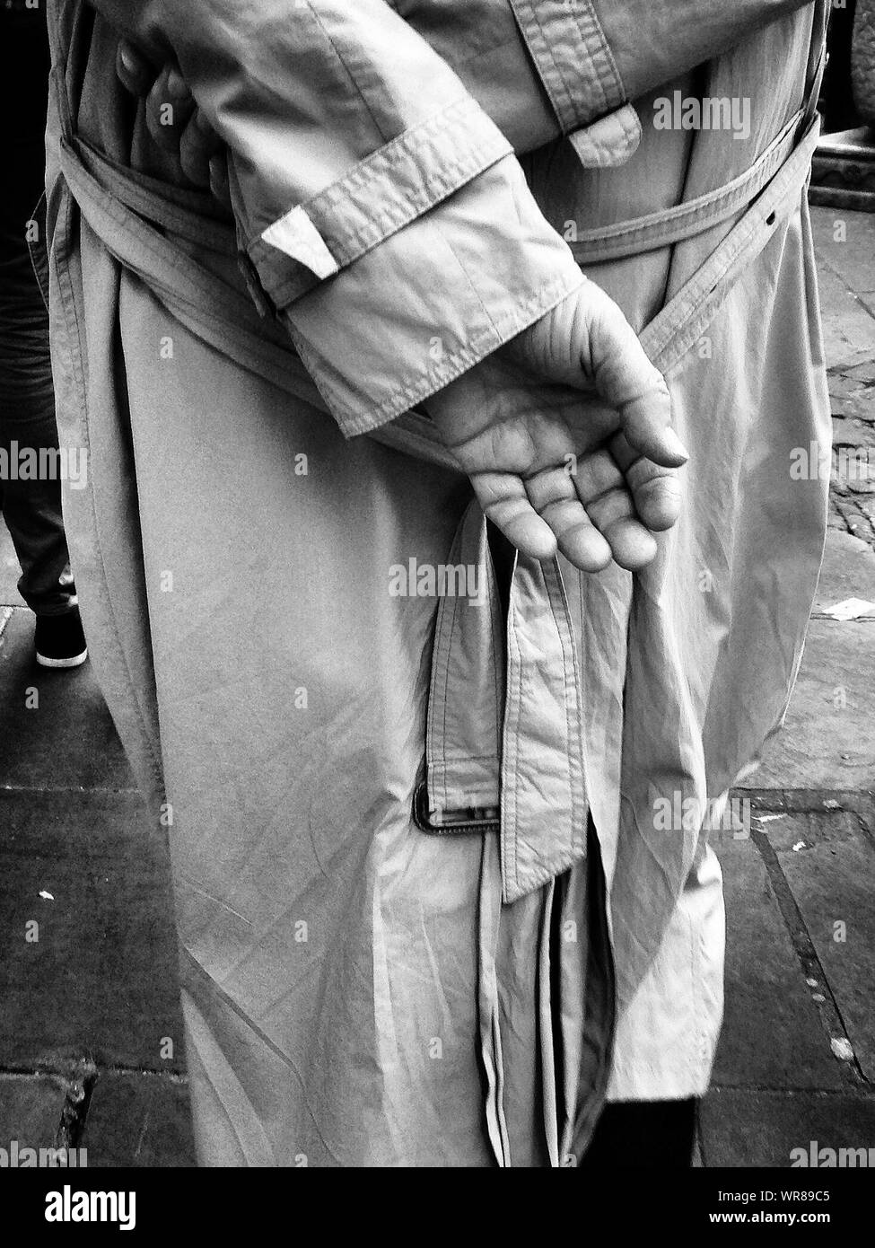 Man hands behind back rear view Black and White Stock Photos & Images ...